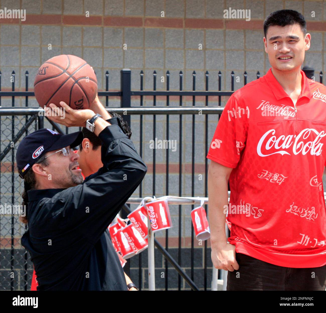 Kyle Petty, left, takes a shot as Houston Rockets center Yao Ming, of ...