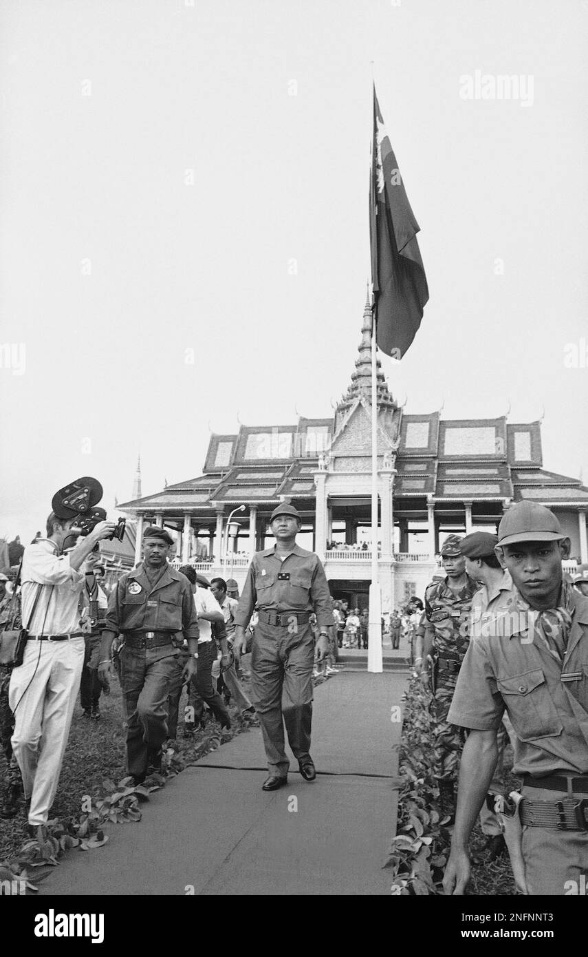 Cambodian Prime Minister, a newly promoted General Lon Nol, walks away ...
