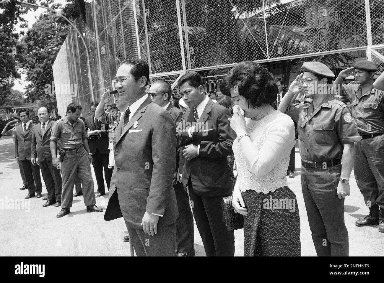 Cambodian President Lon Nol, left, and his wife break into tears during ...