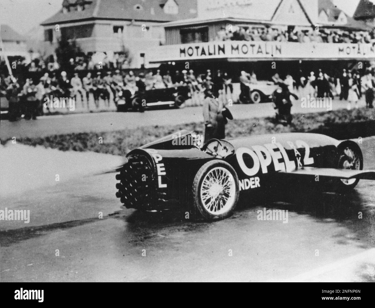 Fritz von Opel rides a rocket propelled Opel RAK 2 test car, reeching a ...