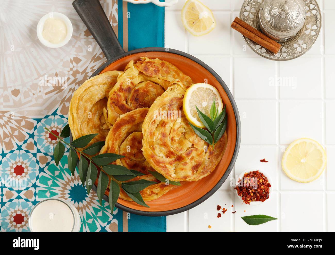 Roti Parata or Roti Canai with Lamb Curry Sauce and Lemon, Popular ...