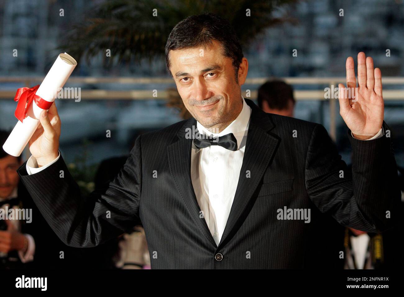 Turkish director Nuri Bilge Ceylan poses with the Best Director award ...
