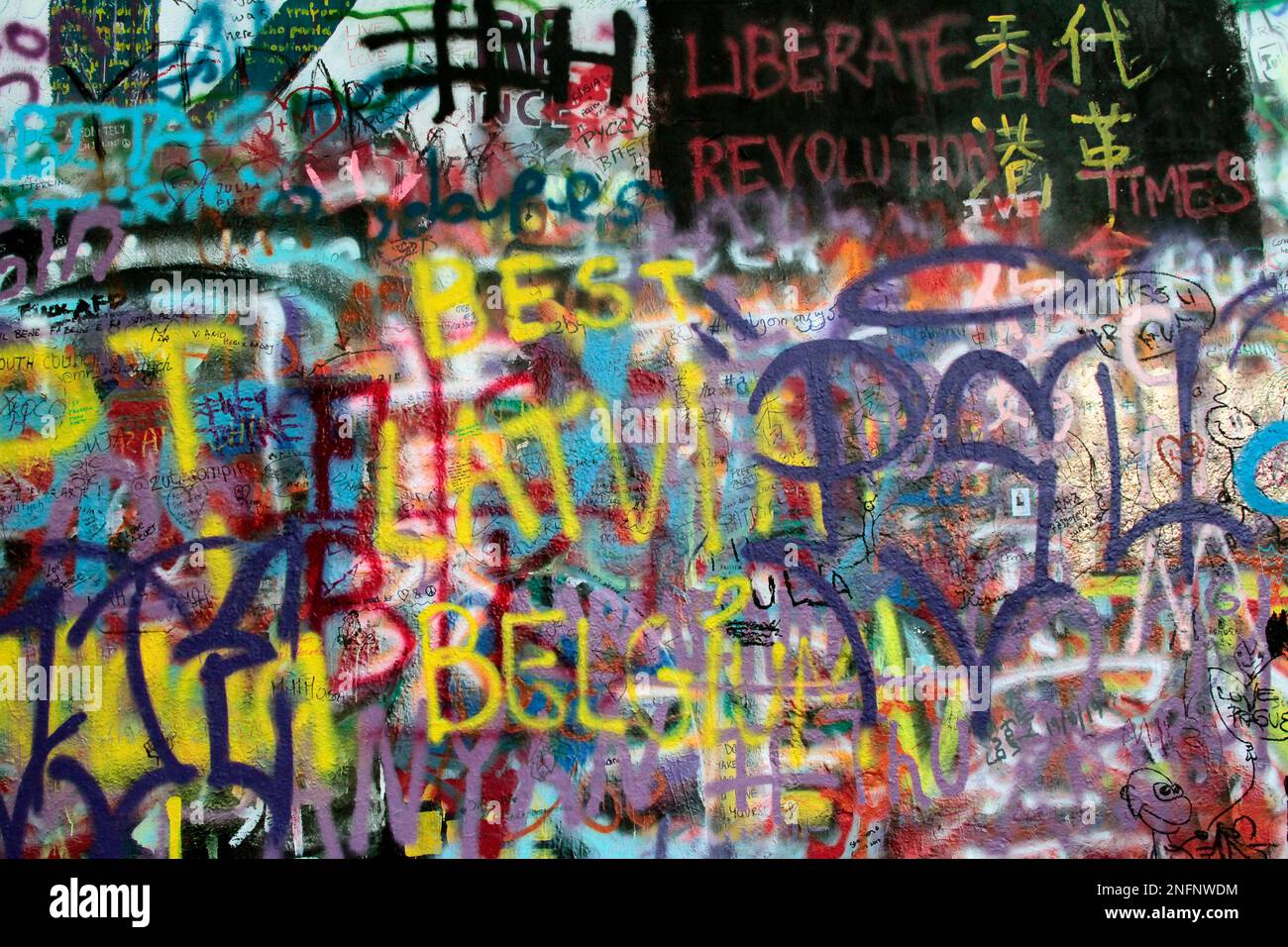 Graffiti wall, colorful with political statements Stock Photo - Alamy