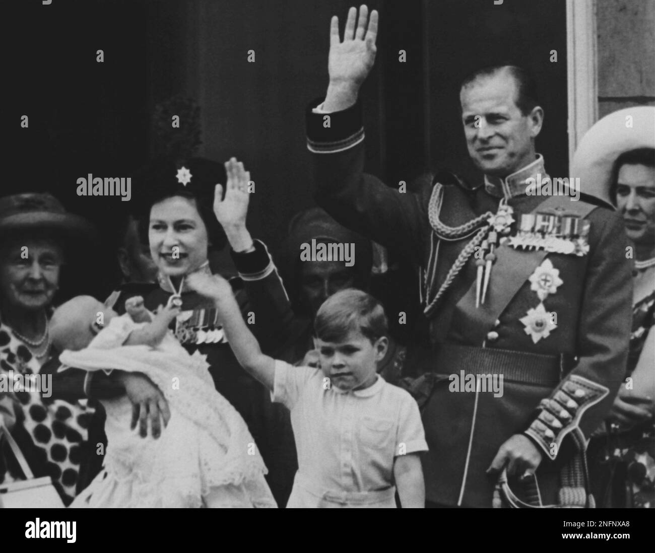 Queen Elizabeth II holds her 12 week old son, Prince Edward, as she ...