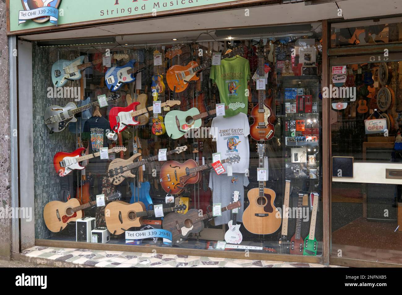colourful display of guitars in Guitar Shop window, Great Western Road ...