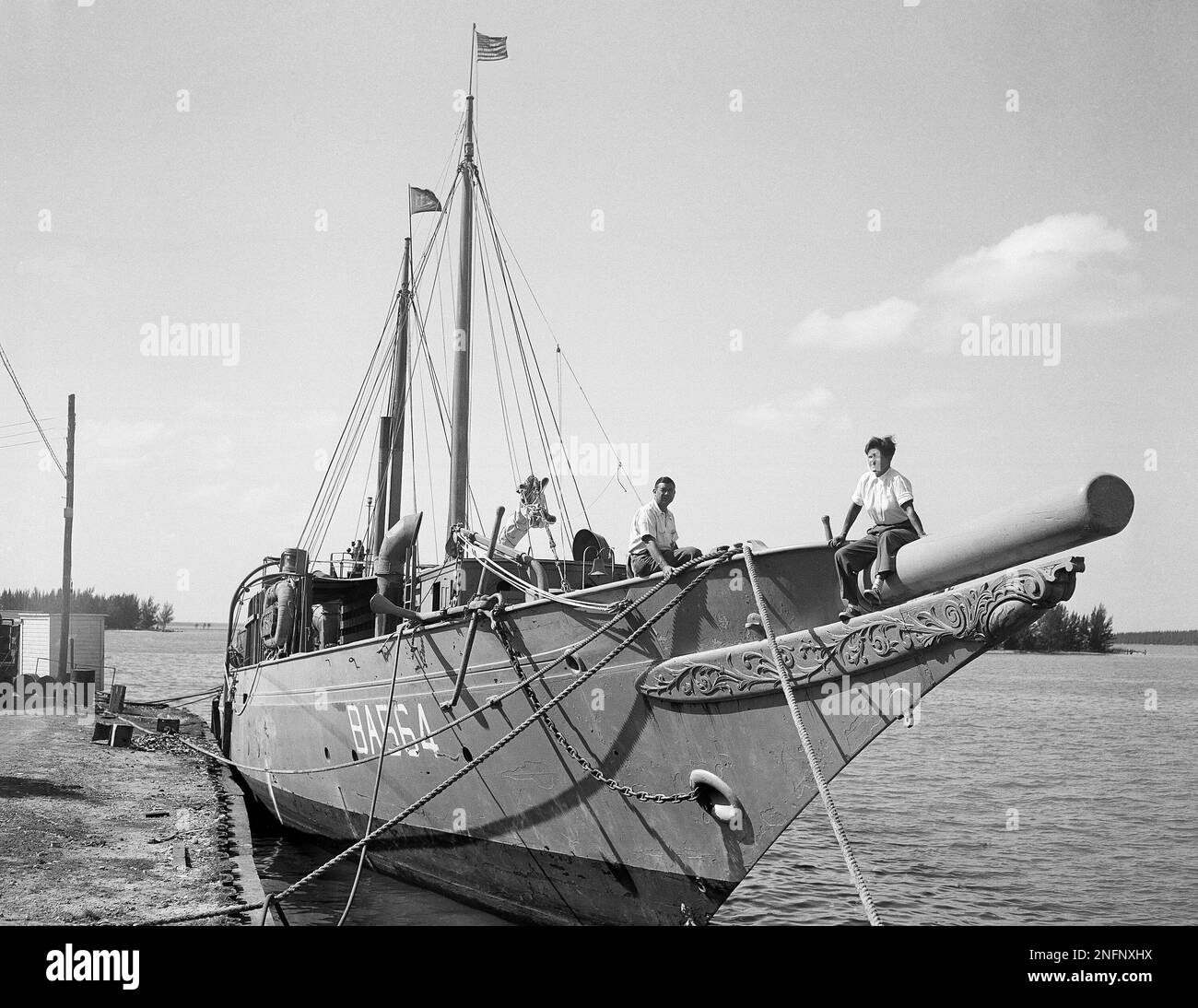 Betty Carstairs, English speedboat racer, sits on the Bowsprit of her ...