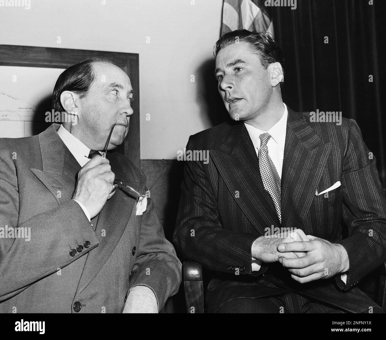 Guided by his attorney Jerry Chelser, left, Errol Flyyn began a recital ...
