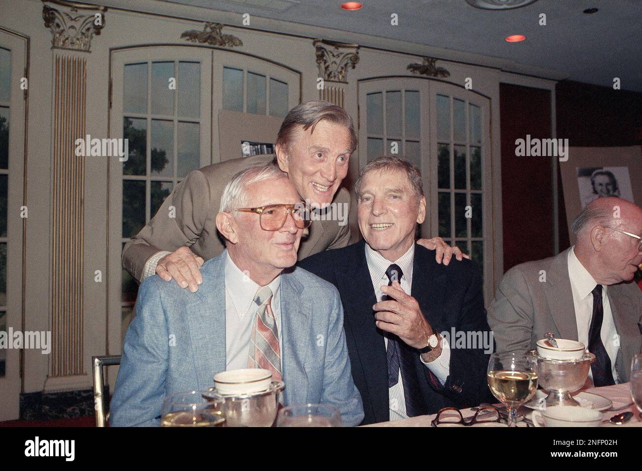 Actors Burt Lancaster, right, and Kirk Douglas, center; pose with ...