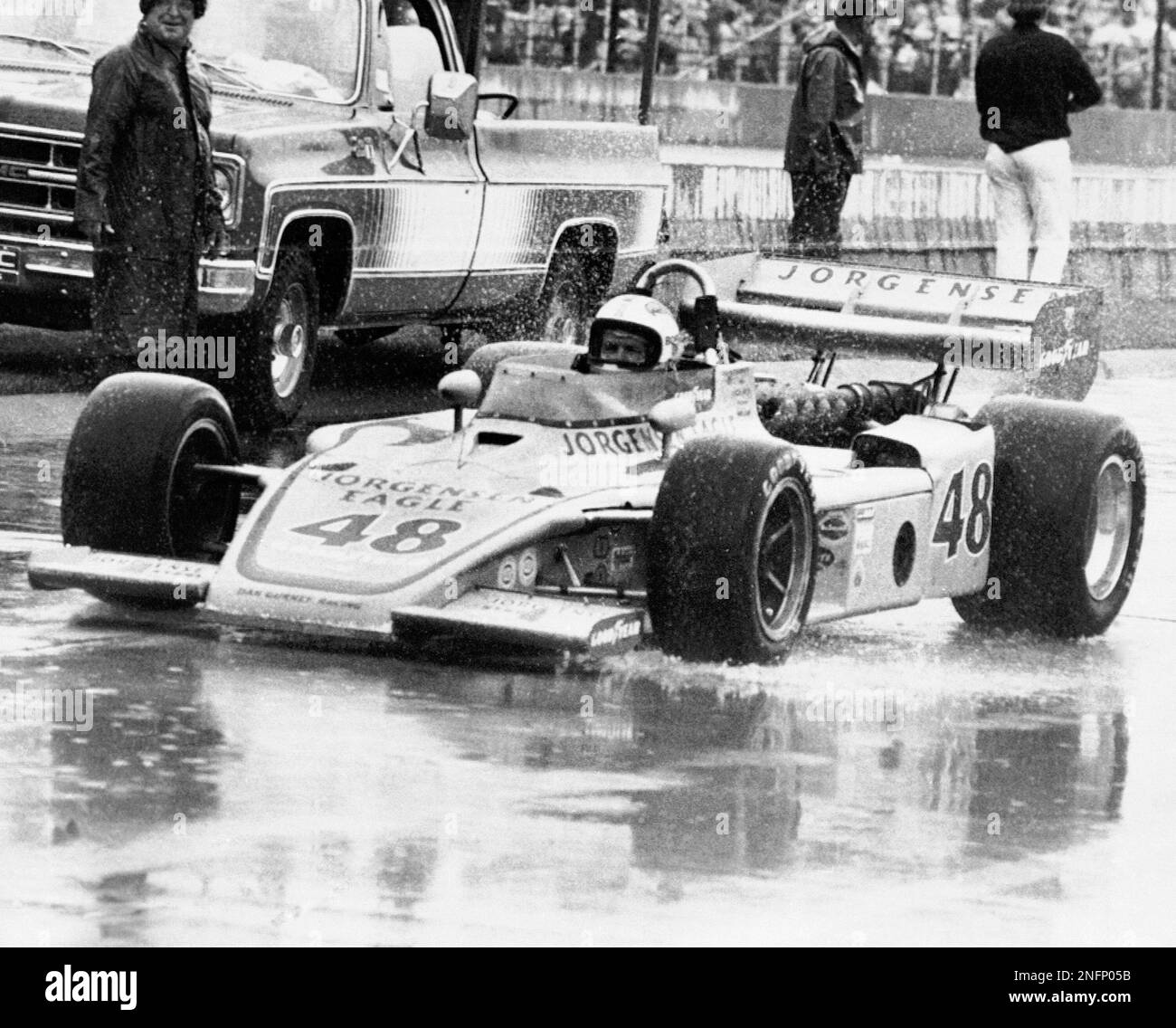 Bobby Unser guides his Eagle-Turbo Offy into pits area after winning on ...
