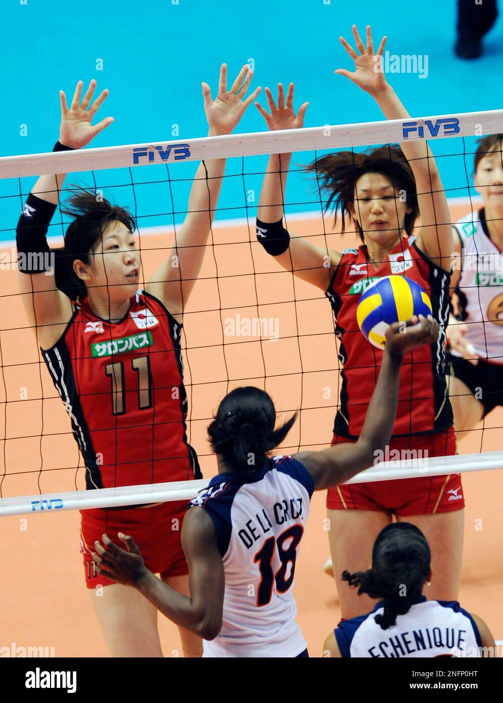 Japan's Erica Araki (11) and Megumi Kurihara block the ball against the ...