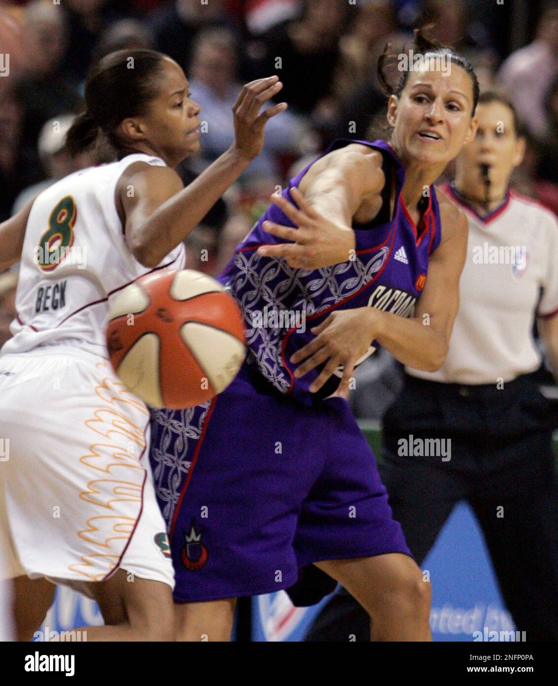 Sacramento Monarchs' Ticha Penicheiro, right, gets a pass past Seattle ...