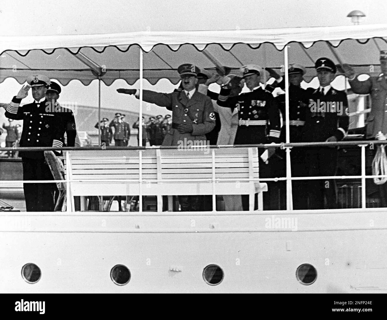 Germany's Chancleoor Adolf Hitler, centre, gives a Nazi salute to a ...