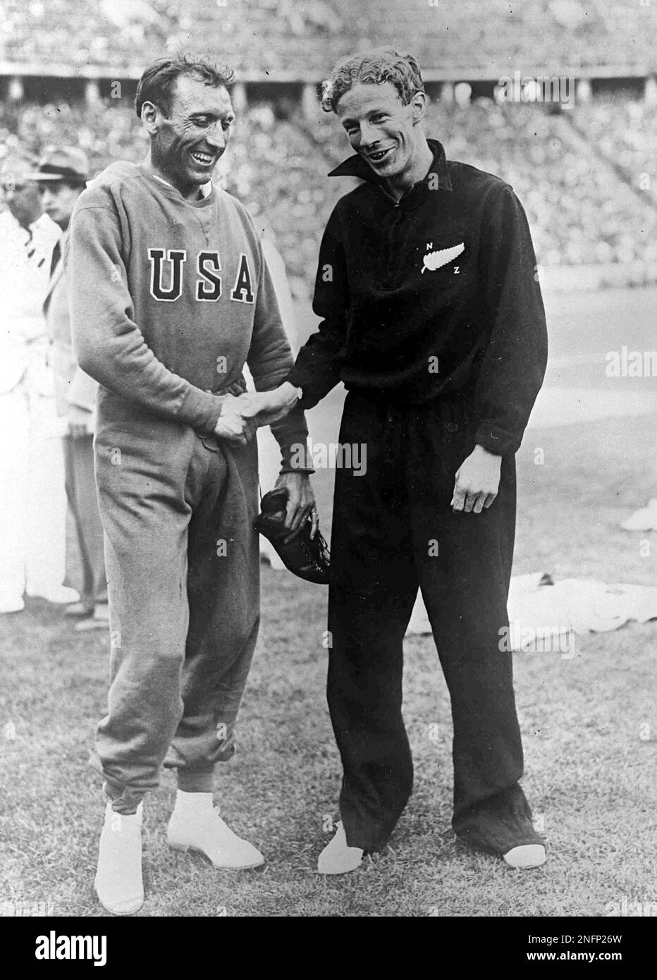 New Zealand's John Lovelock, right, is congratulated by American Glenn ...