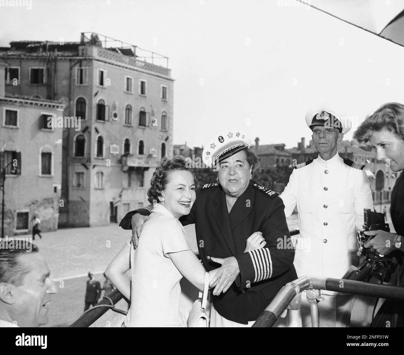 Famed party giver Elsa Maxwell, attired in fancy cap and admiral's gold ...