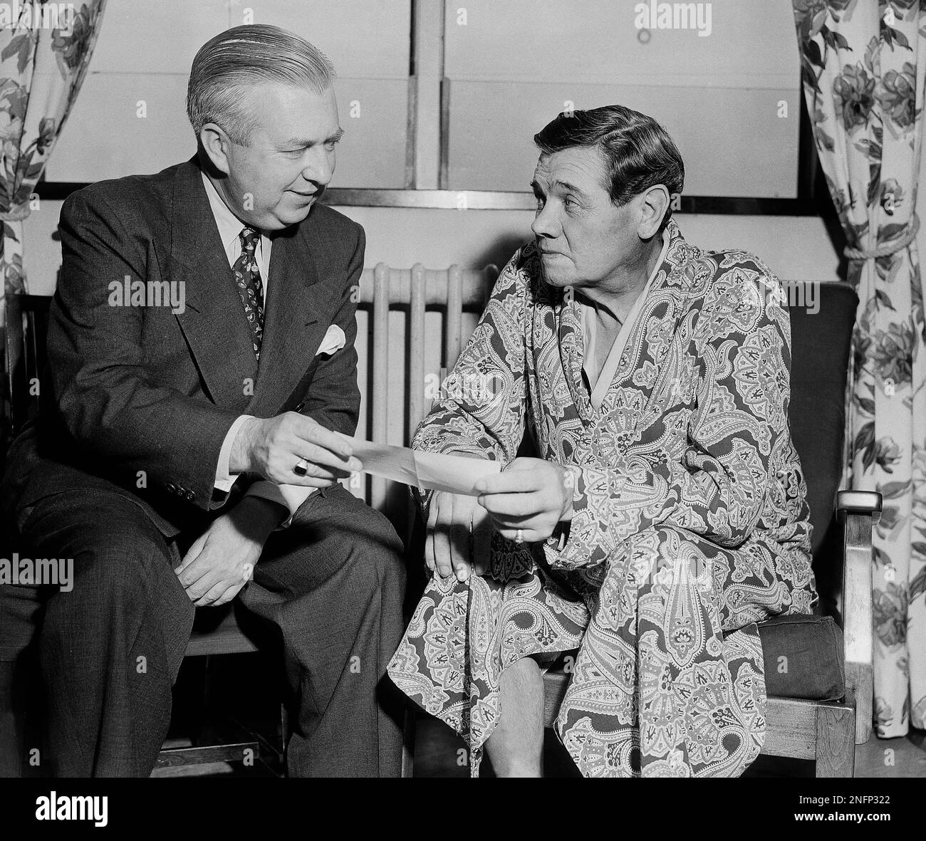 Steve Broidy, left, of Allied Artist movie studio presents a check for ...