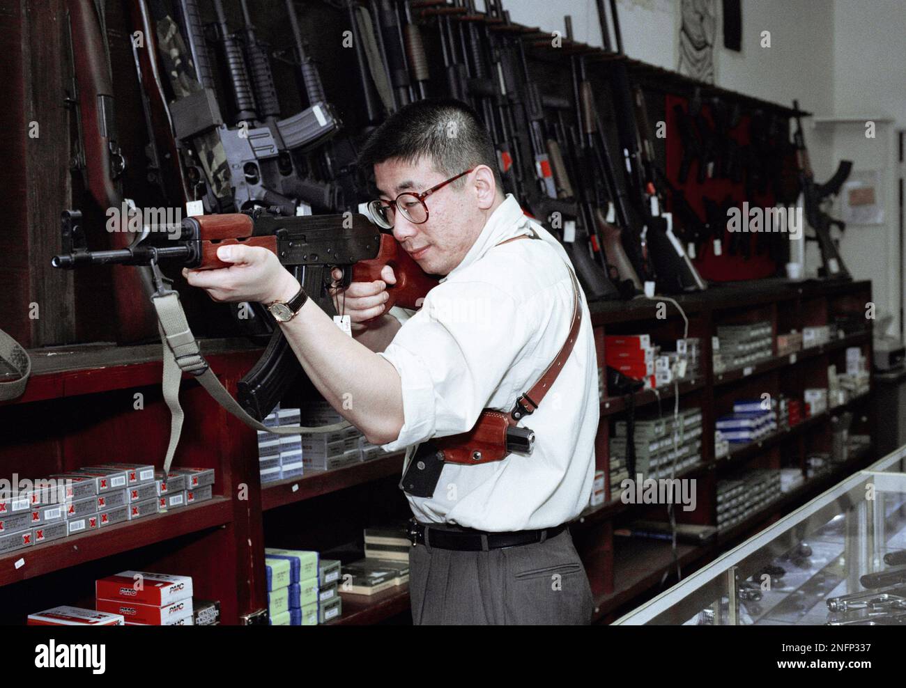 David Chu, manager of the Western Gun Shop shown here on April 8, 1993 ...