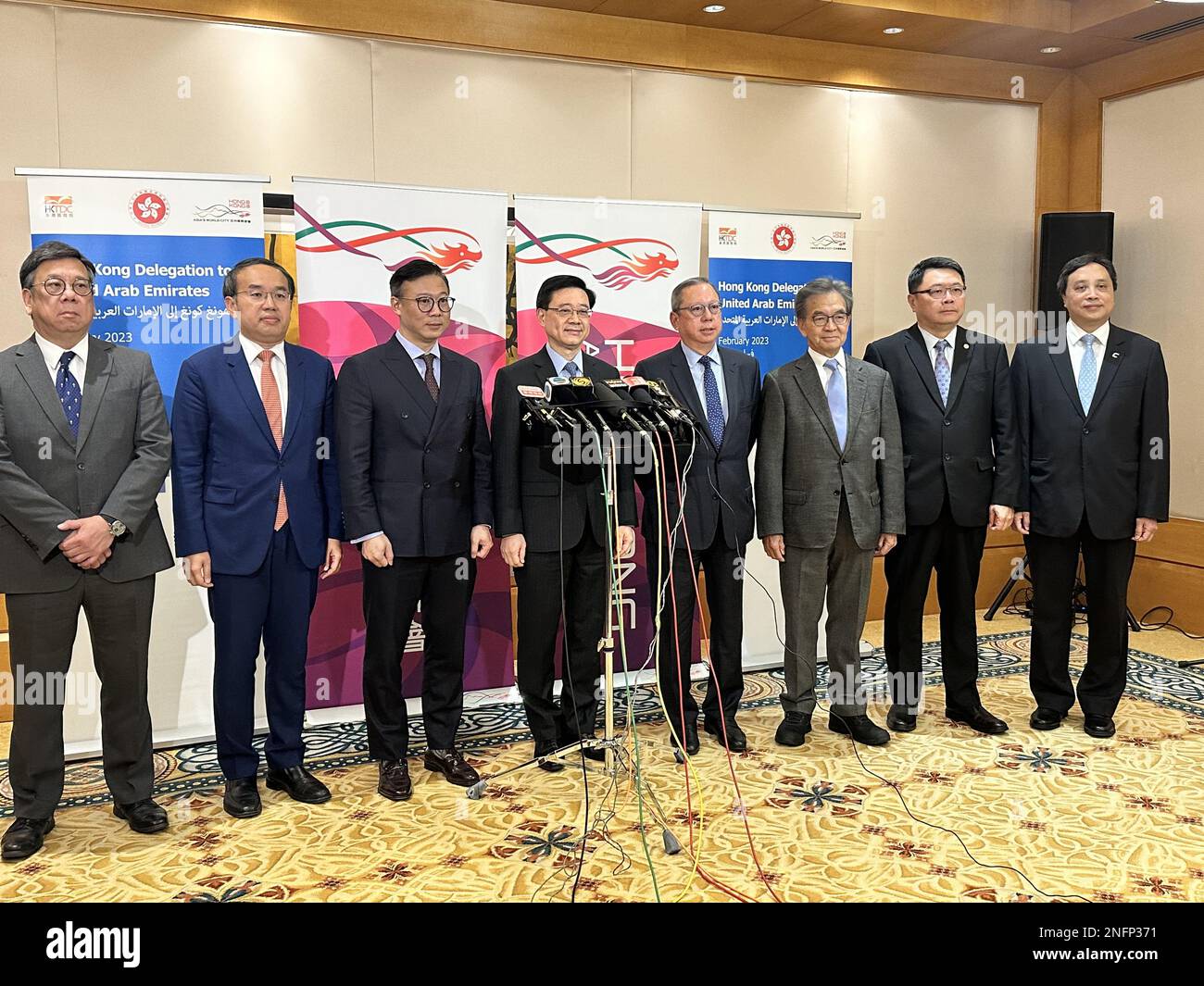 Flanked by Deputy Secretary for Justice Horace Cheung Kwan-kwan (centre ...