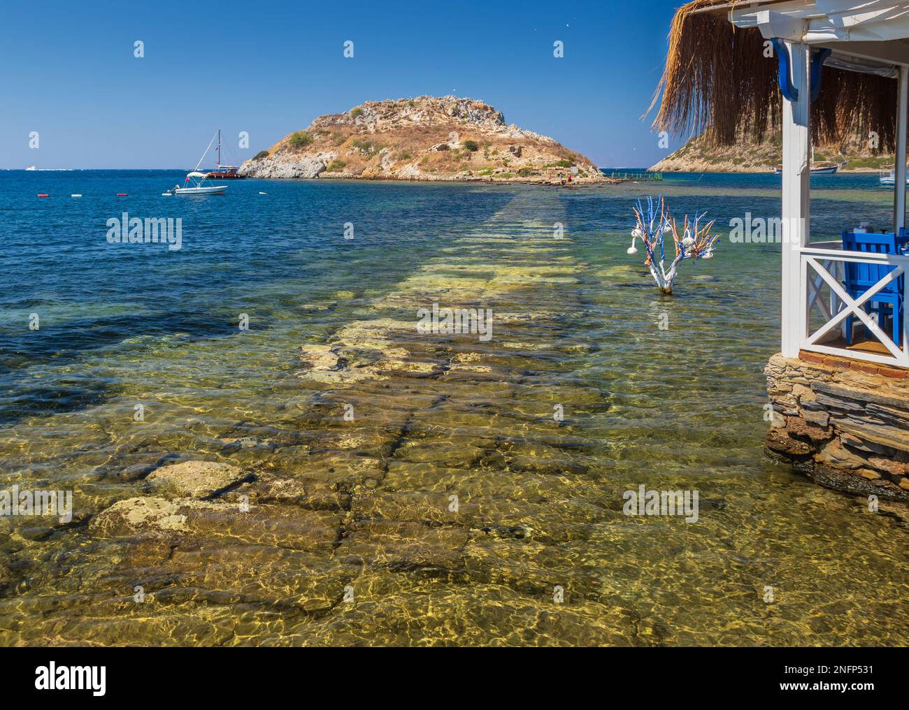 submerged path to Tavsan Adasi (Rabbit island), Gumusluk, Turkey Stock ...