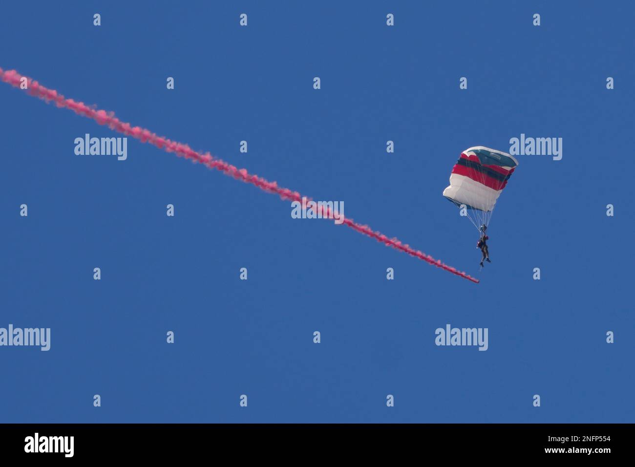 A member of Iraq's national skydiving team, prepares to land in front ...