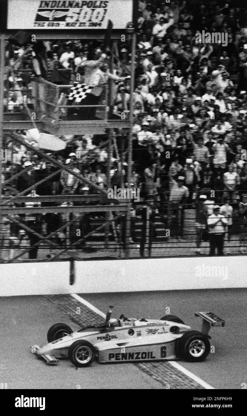 Rick Mears driving his #6 March-Cosworth, takes the checkered flag at ...