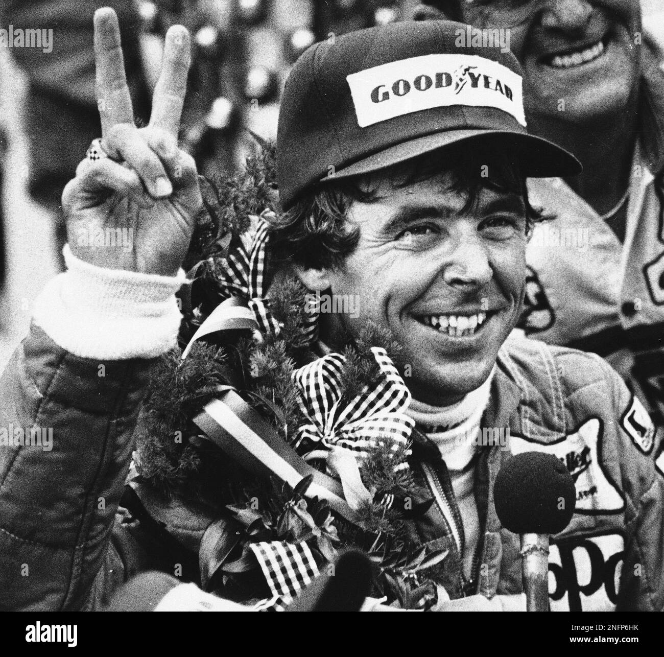 Driver Rick Mears of Bakersfield, Calif., signals his second ...