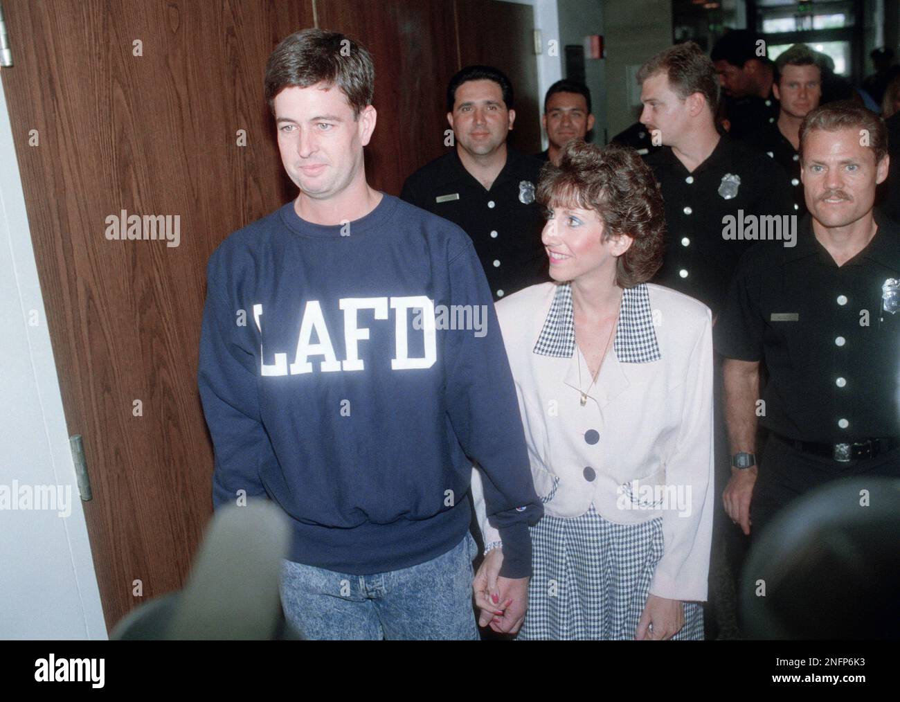 Los Angeles firefighter Scott Miller, backed by fellow firefighters and ...