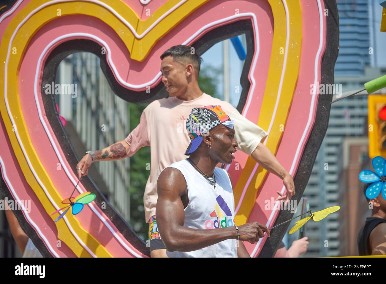Toronto Ontario, Canada- June 26th, 2022: two males dancing on a parade ...