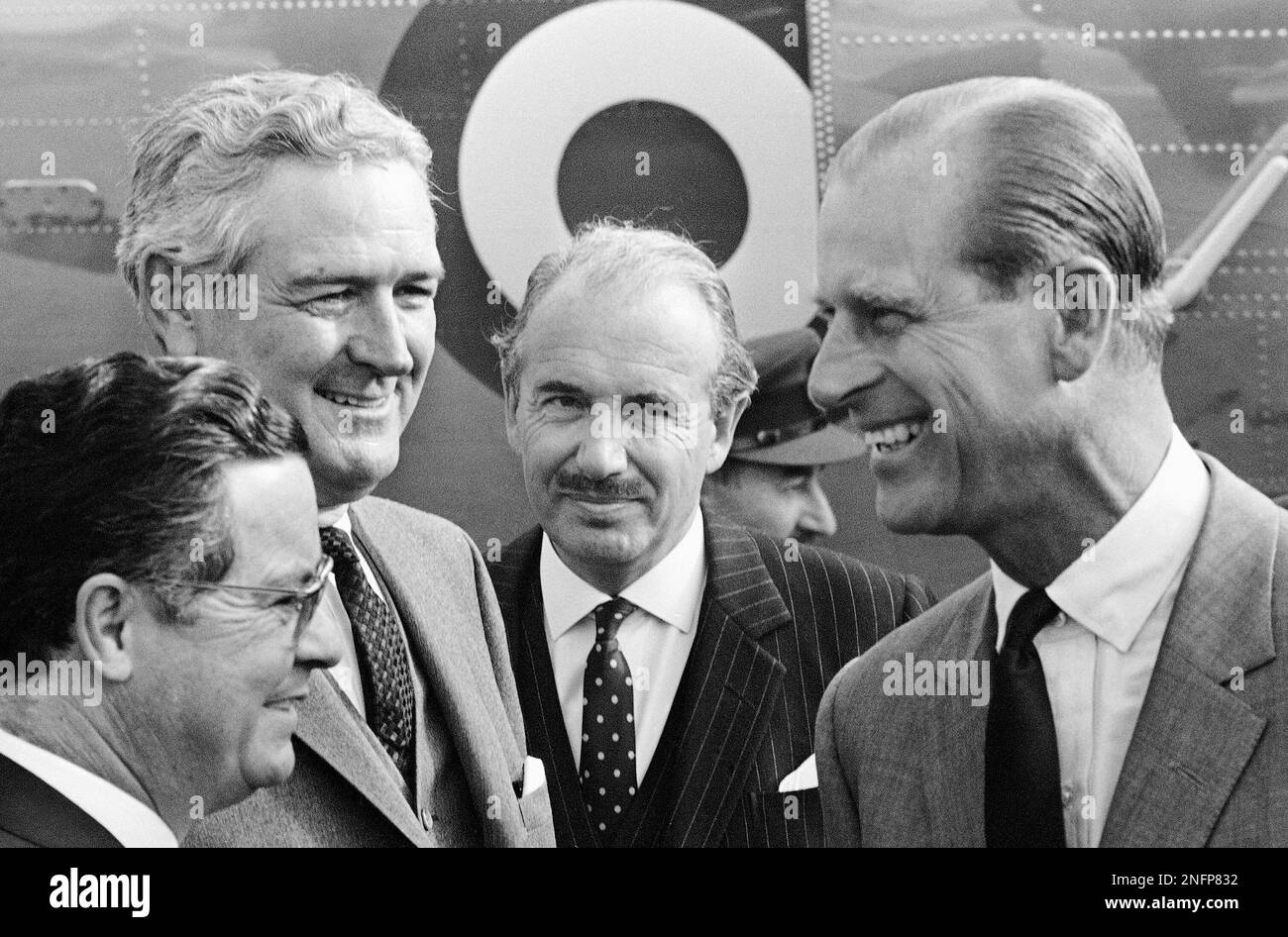 Prince Philip of Britain, right enjoys the exchange of greetings on his ...