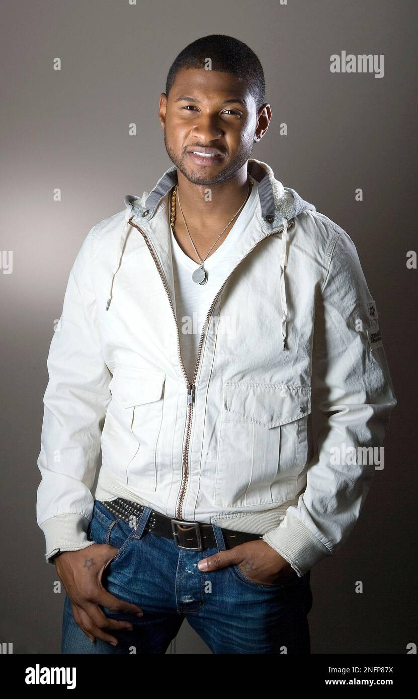 Singer Usher poses for photographs in his dressing room before appearing on the "Ellen DeGeneres ...