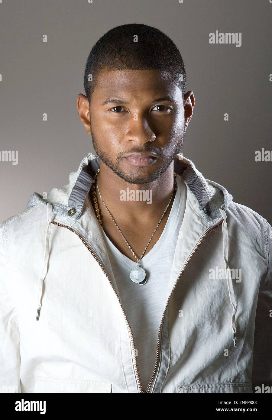 Singer Usher poses for photographs in his dressing room before ...