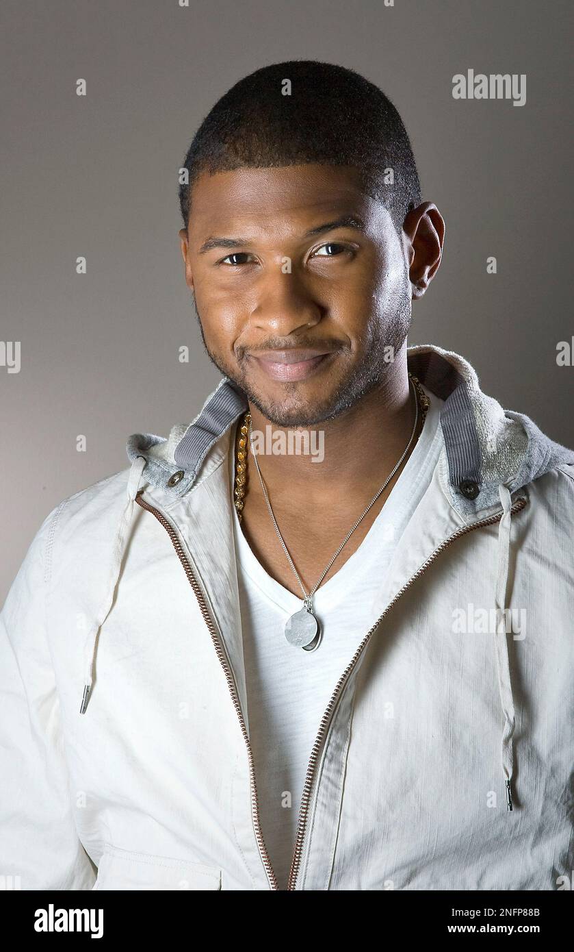 Singer Usher poses for photographs in his dressing room before ...