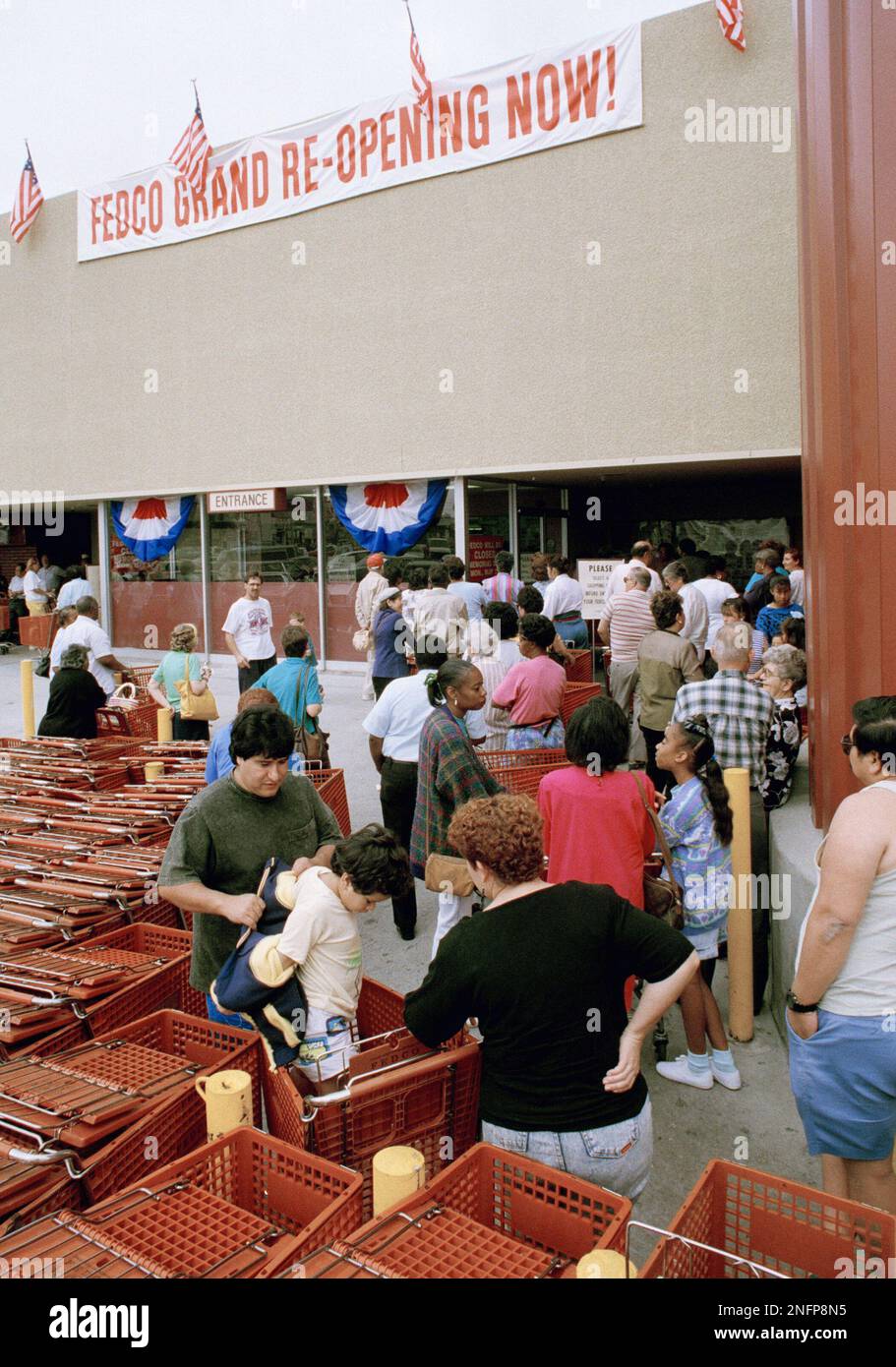 Crowds line up outside Fedco department store early on May 23, 1992 in ...