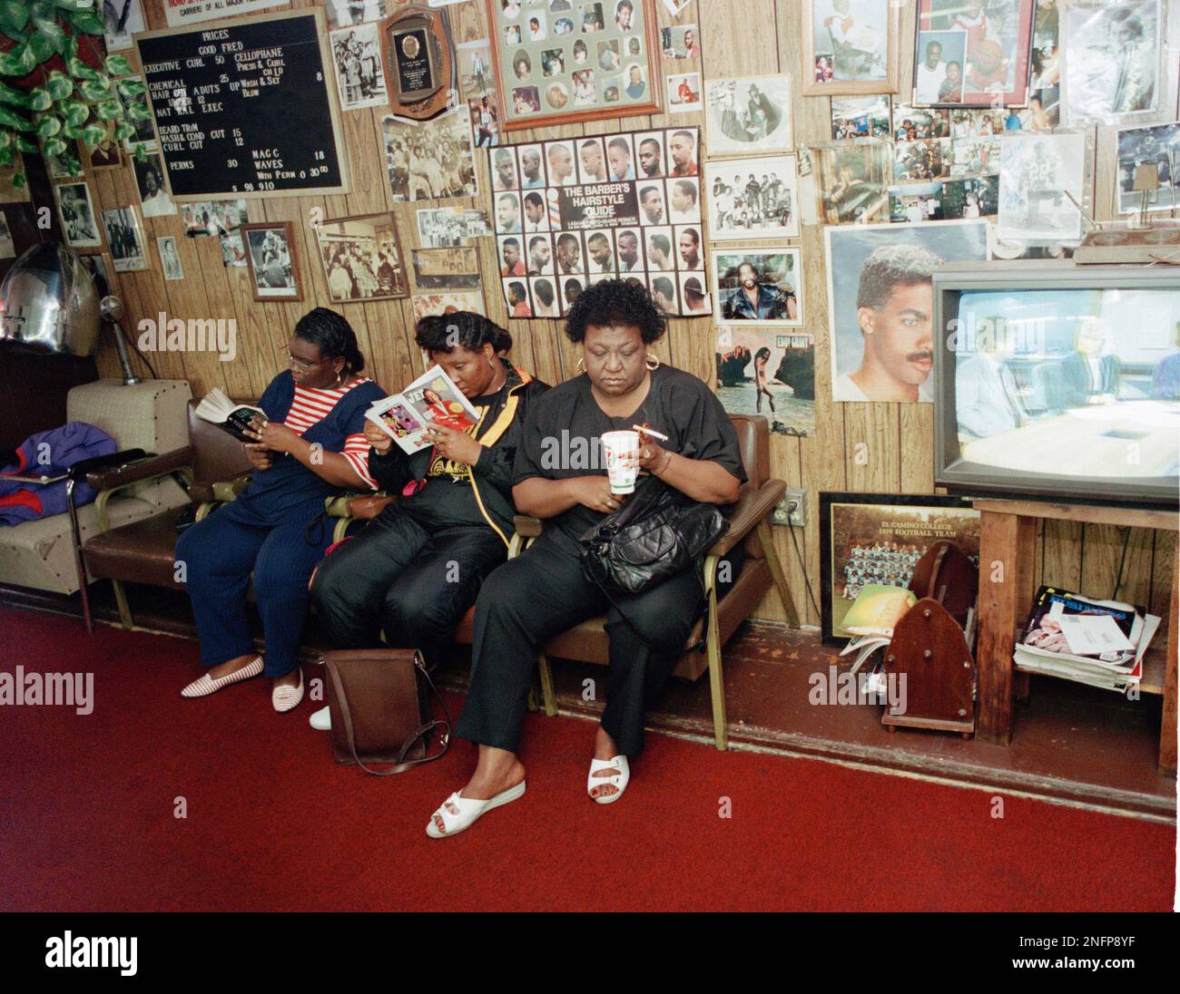 With the television news playing on a local channel, residents of South ...