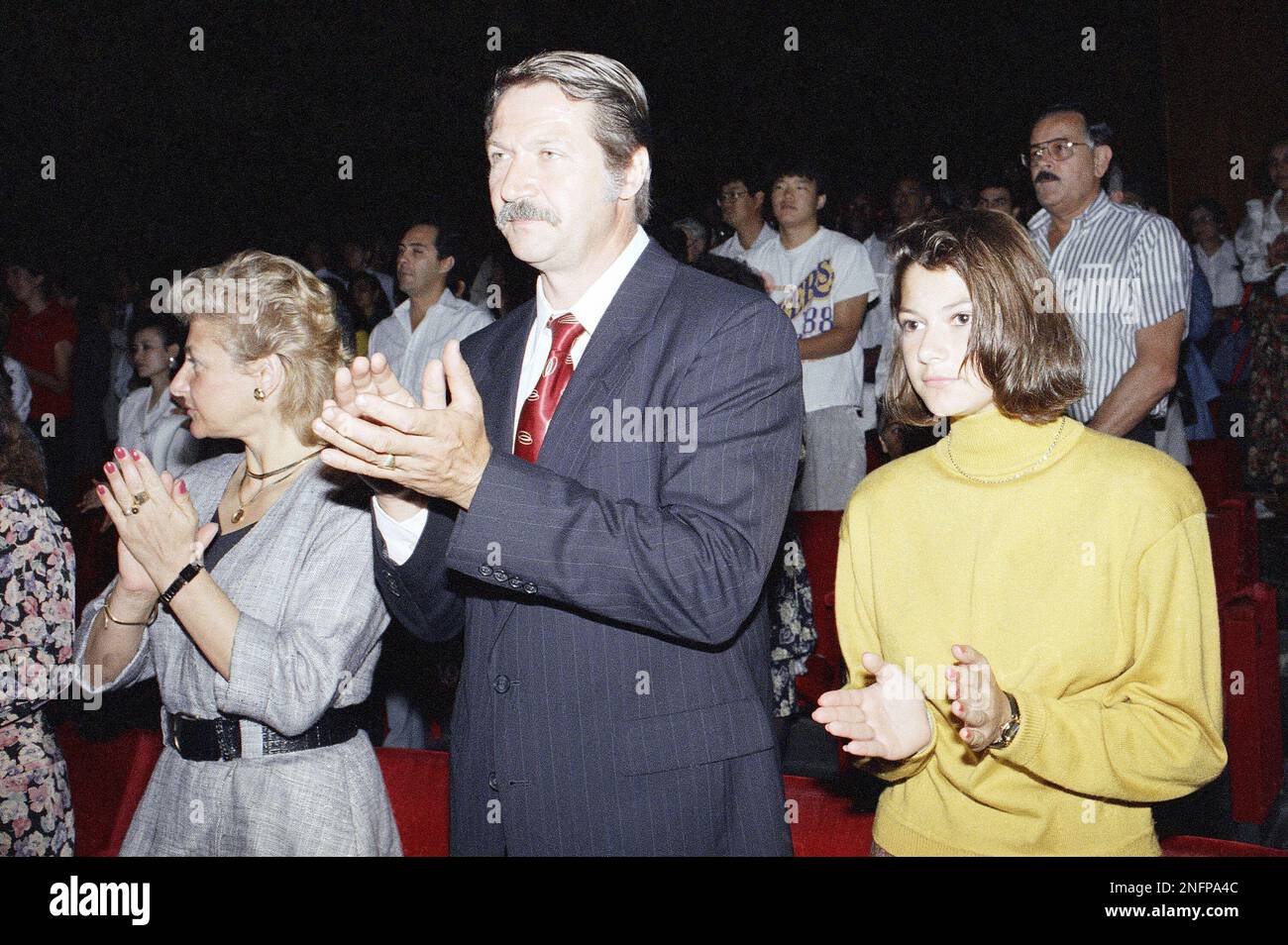 Internationally known gymnastics coach Bela Karolyi, flanked by his ...