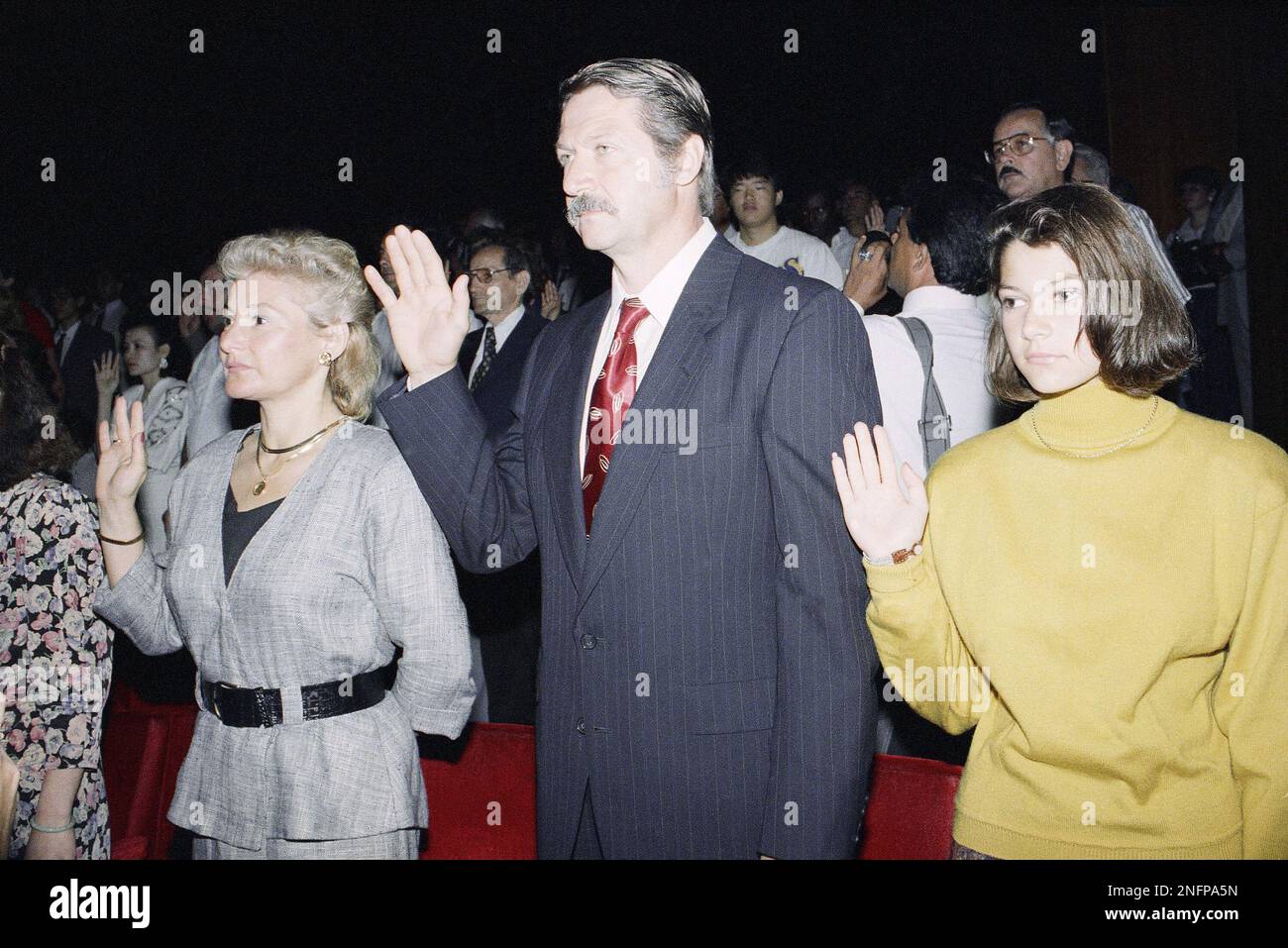 Internationally known gymnastics coach Bela Karolyi, flanked by his ...