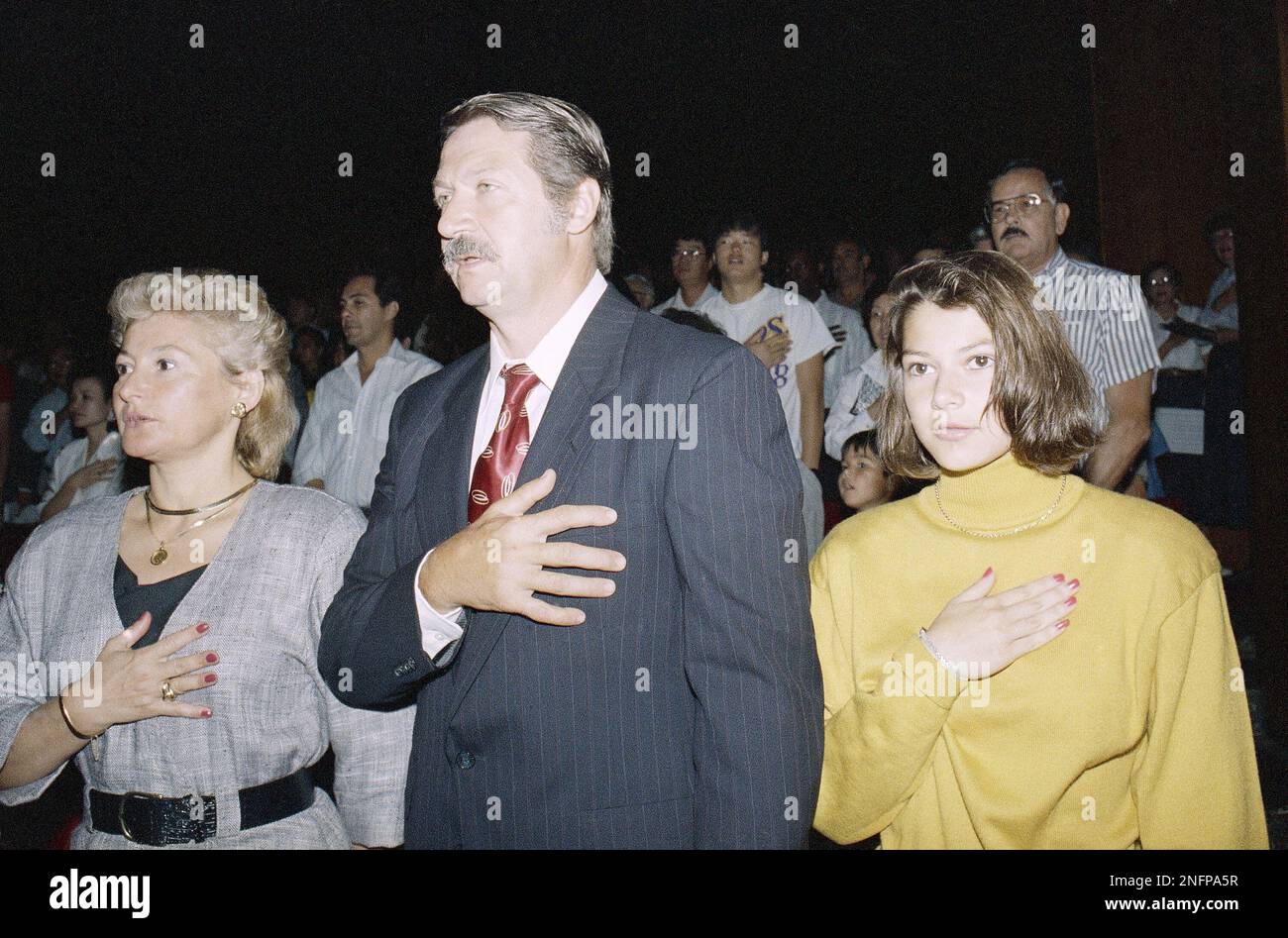 Internationally known gymnastics coach Bela Karolyi, flanked by his ...