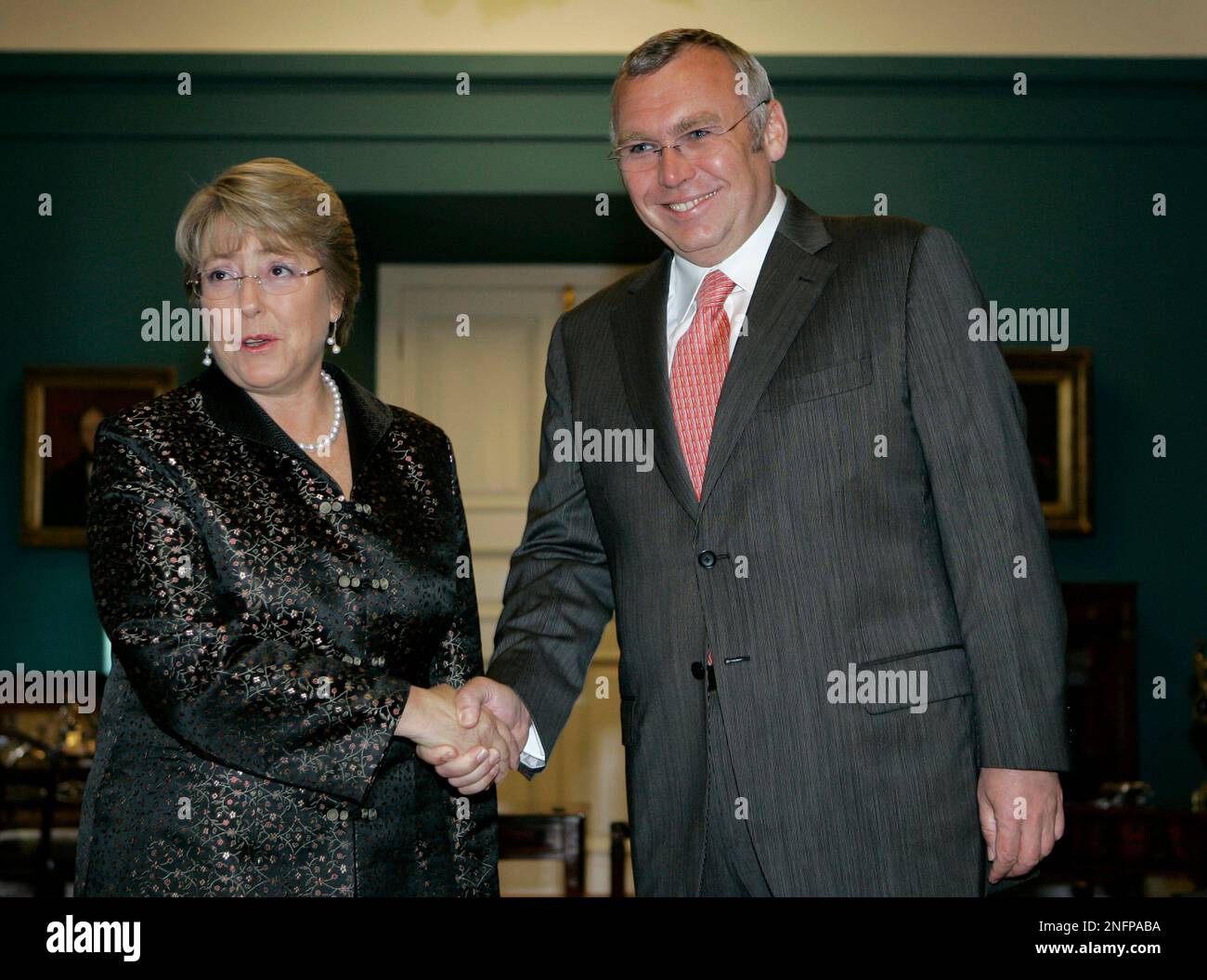 Chile's President Michelle Bachelet, left, shakes hands with Austria's ...