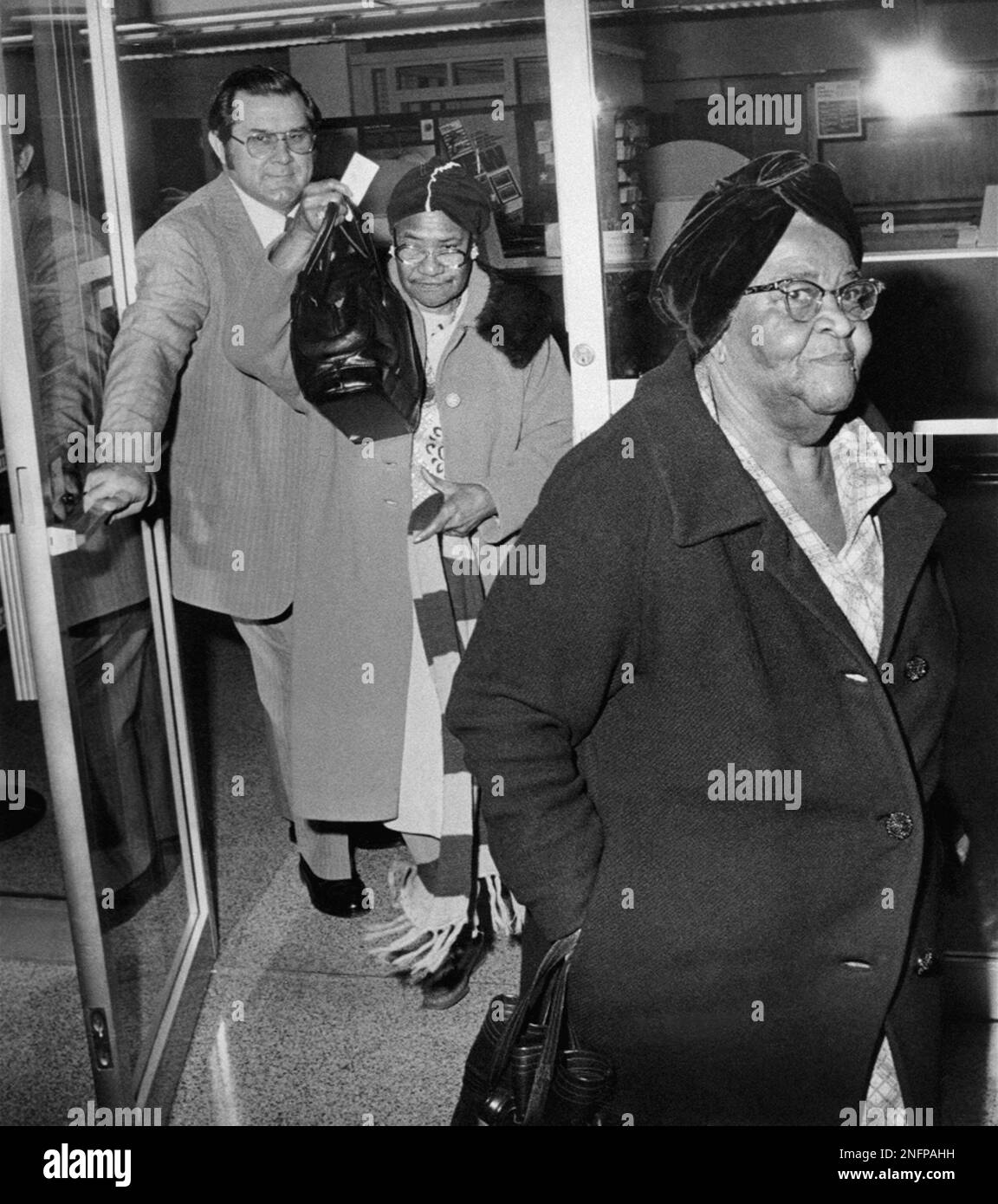 An investigator for Mrs. Frania Tye Lee escorts Annie Mae Stephenson ...