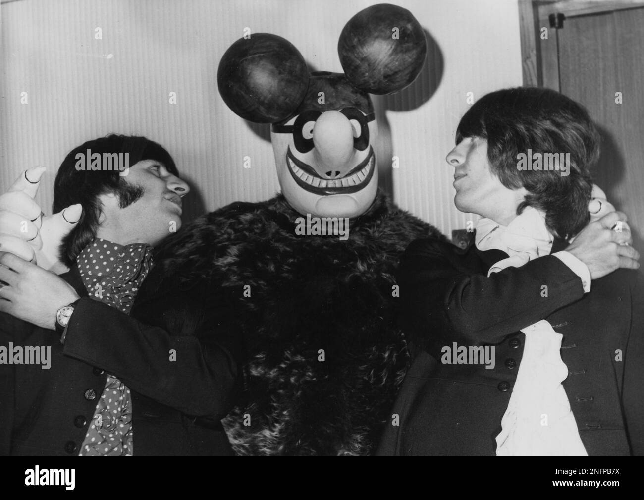 Ringo Starr, left, and George Harrison, pose with "Blue Meanie" one of ...