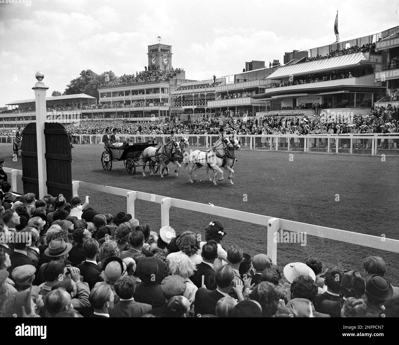 Britain's King George VI and Queen Elizabeth ride in the Royal Carriage ...
