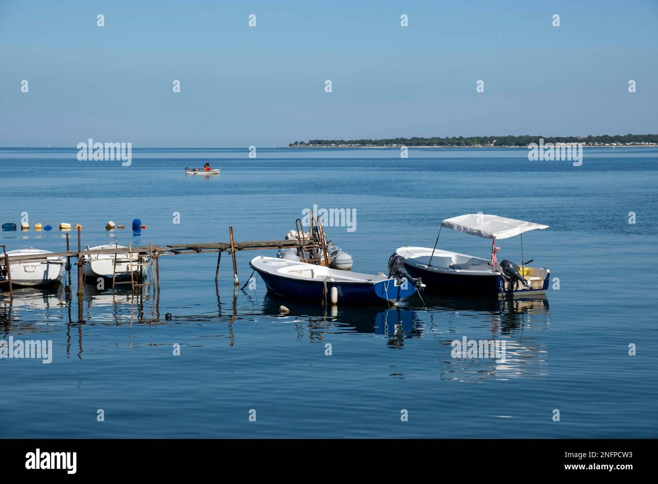 Boats on a jetty Stock Photo - Alamy
