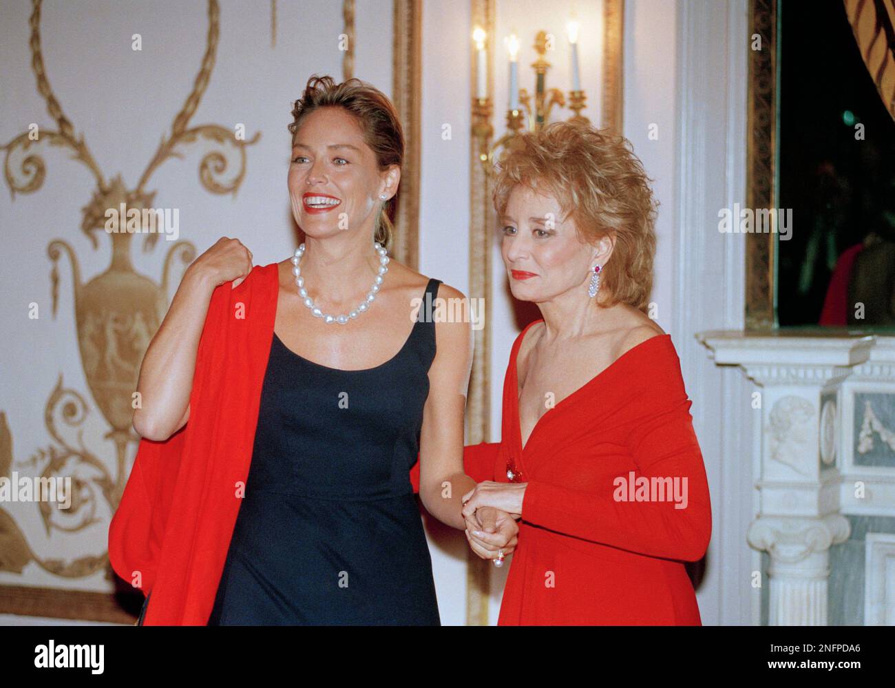 Barbara Walters, right, tells photographers that they would be better ...