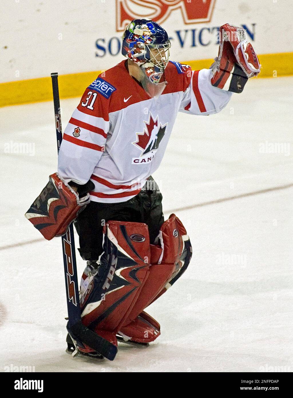 Team Canada's Pascal Leclaire celebrates their 6-3 victory over Team ...