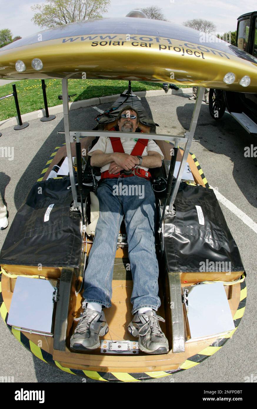 Green Grand Prix founder Bob Gillespie sits in a solar vehicle built by ...