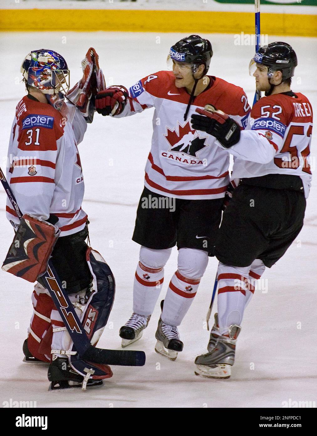 Team Canada's Pascal Leclaire, Steve Staios and Mike Green, left to ...