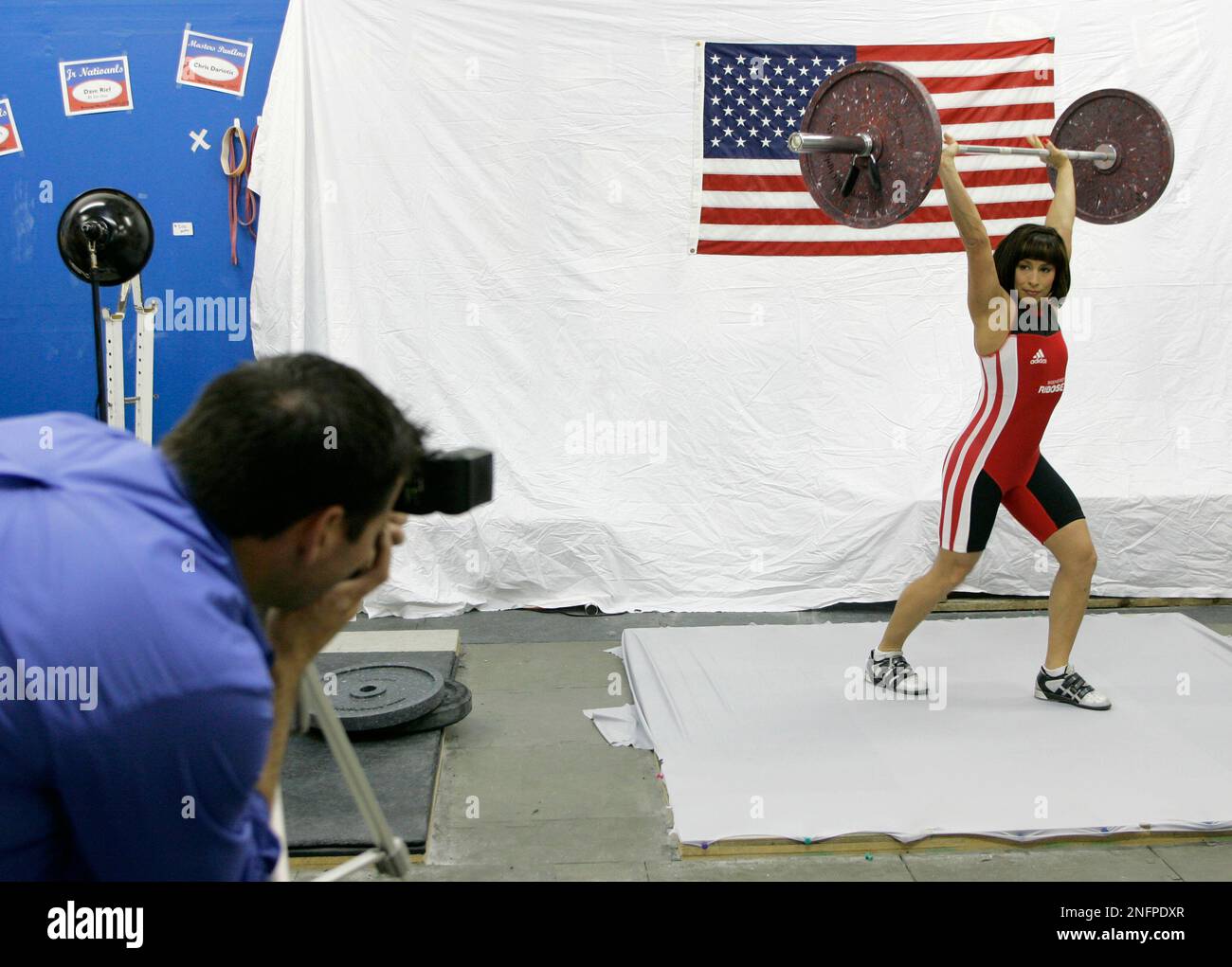 Melanie Roach lifts a bar with rubber weights as she poses for Perry ...