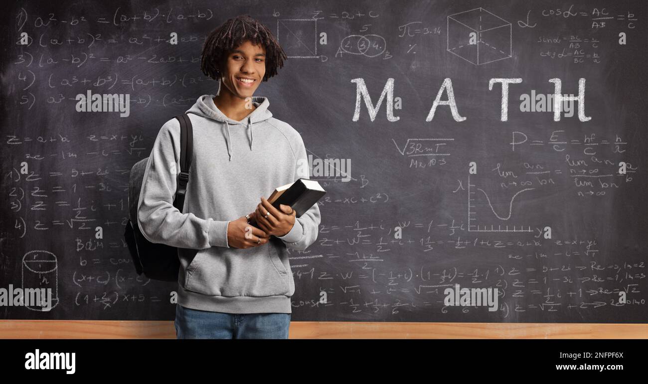Man in front of blackboard math hi-res stock photography and images - Alamy