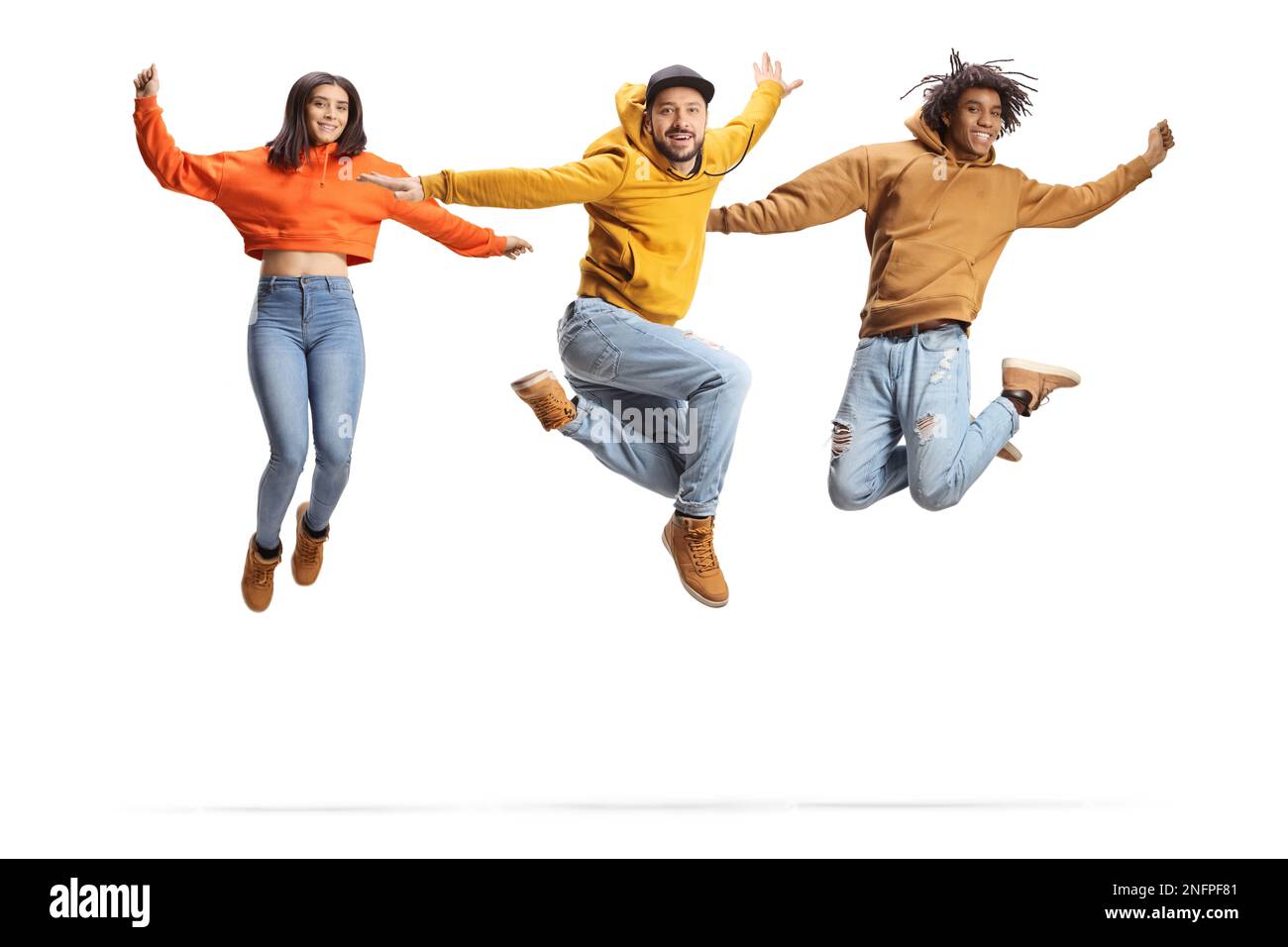 Happy young people jumping isolated on white background Stock Photo - Alamy