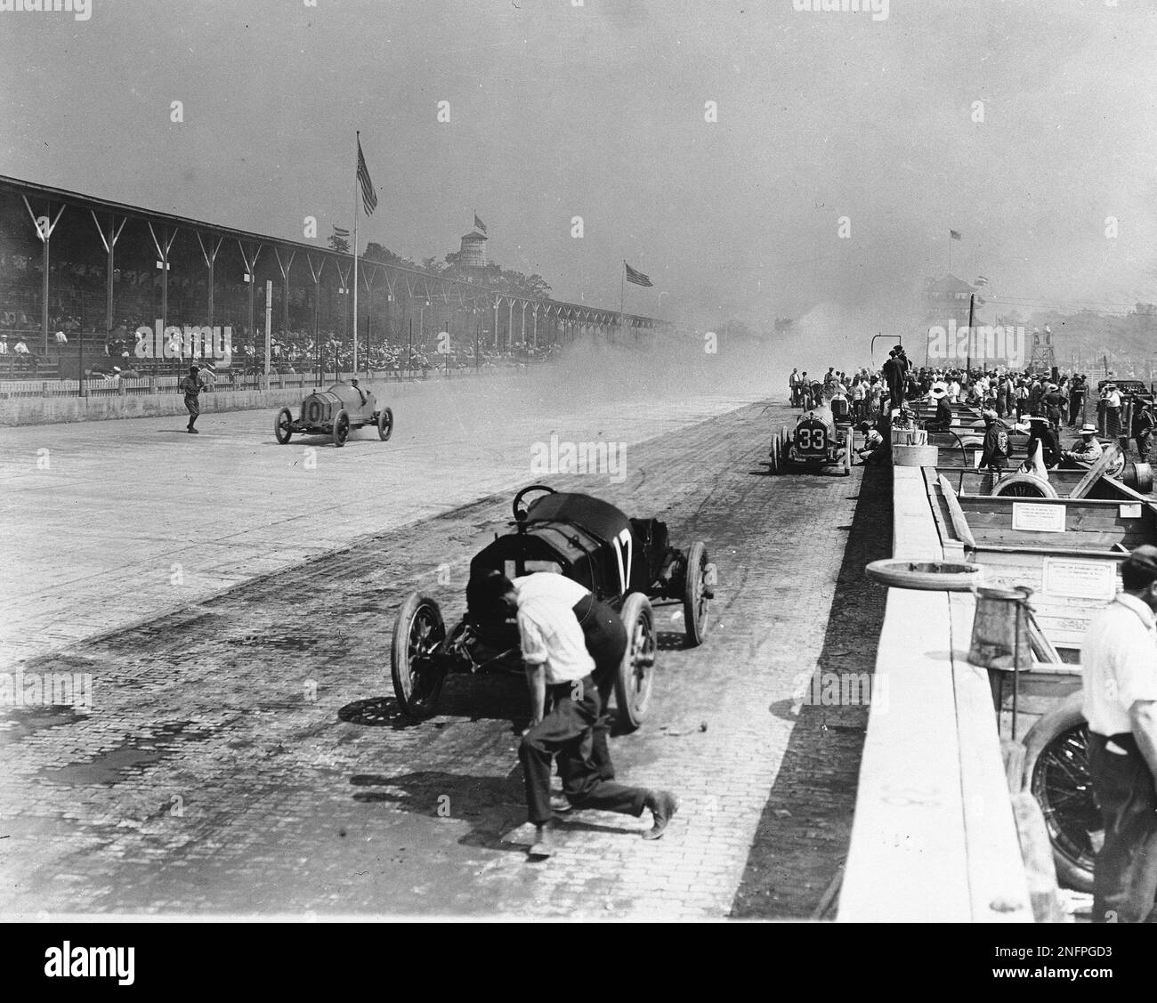Billy Knipper speeds down the track while other entrants are pulled ...