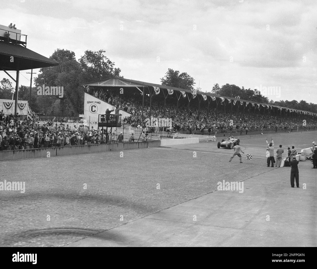 Bob Sweikert, in a Zink Special, left, followed closely by another car ...